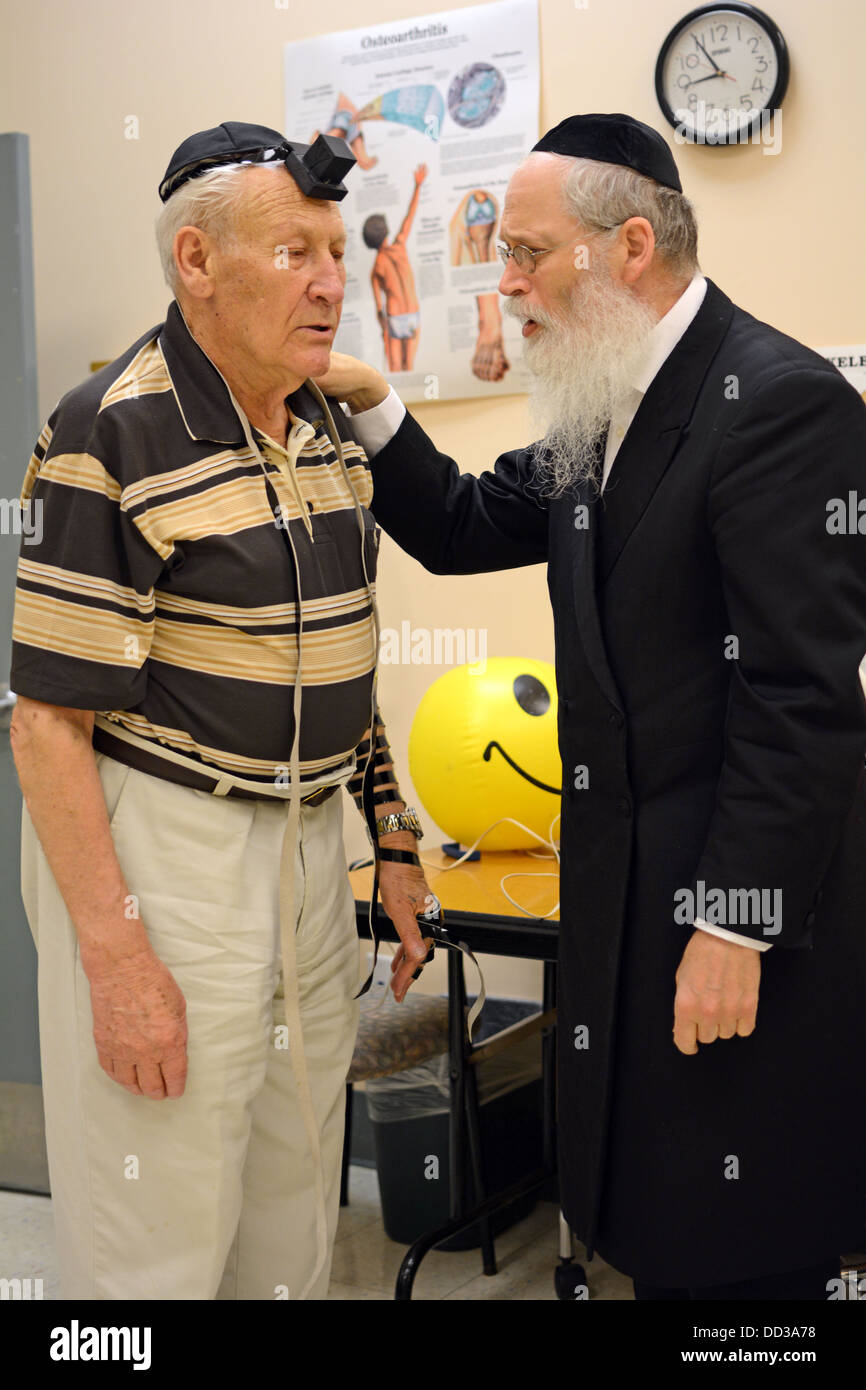 A religious Jewish rabbi visits a senior center in Brighton Beach ...