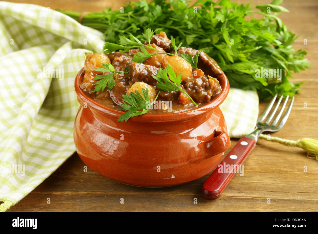 Beef stew with vegetables and herbs in a clay pot - comfort food Stock ...