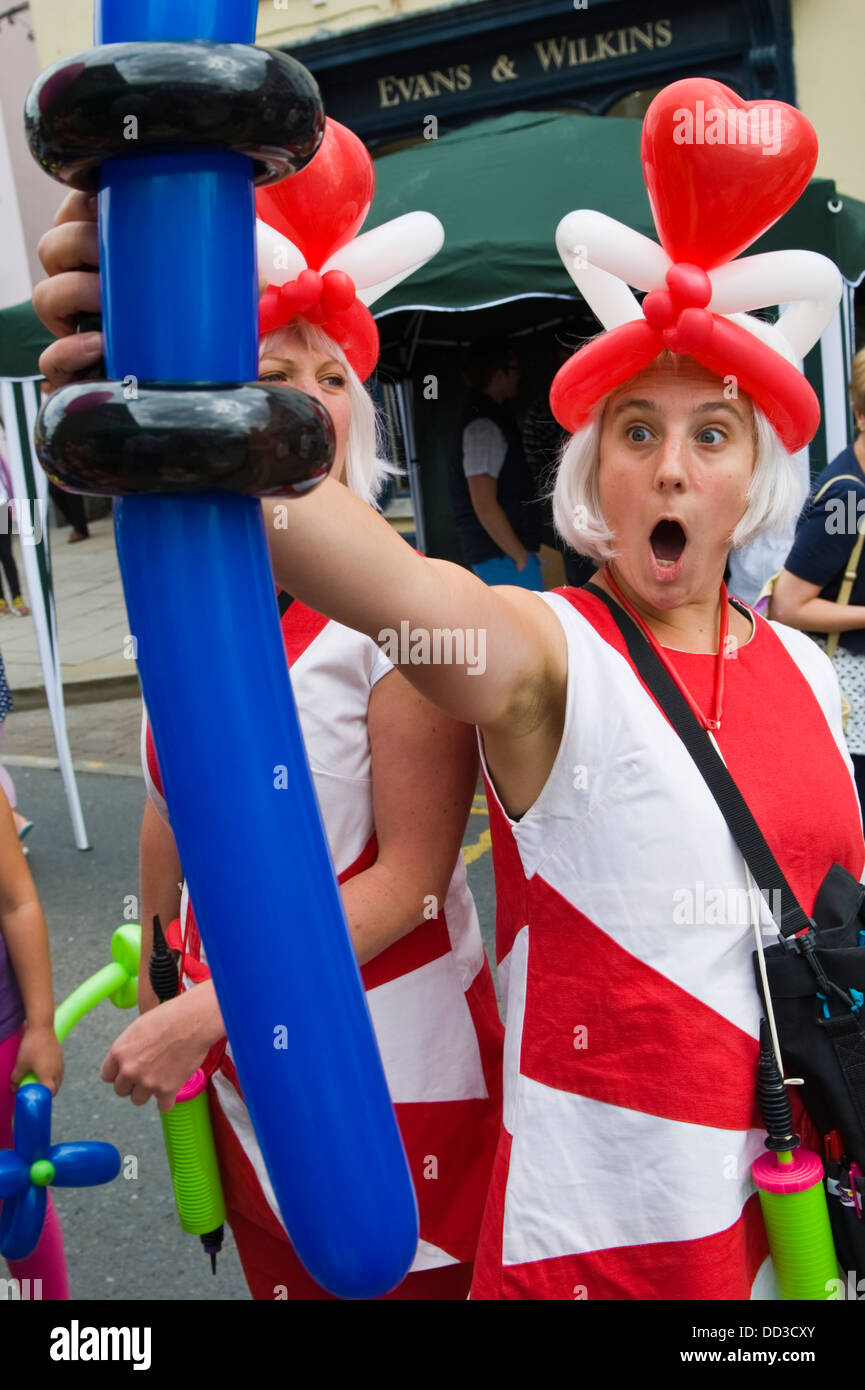 street performer Balloonatic balloon artists making shaped balloons on ...