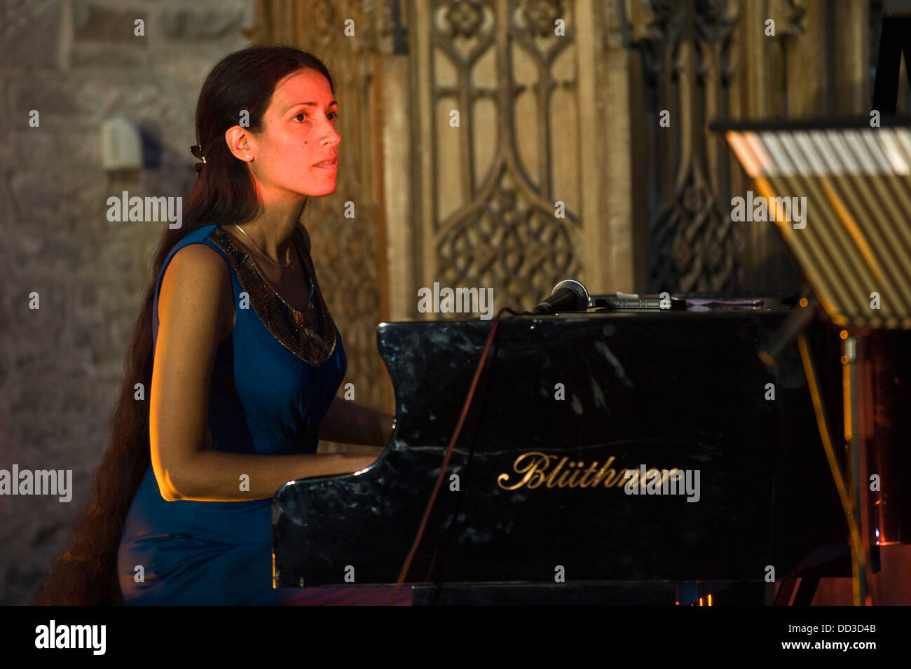 Jazz pianist Zoe Rahman playing with her band in Brecon Cathedral ...