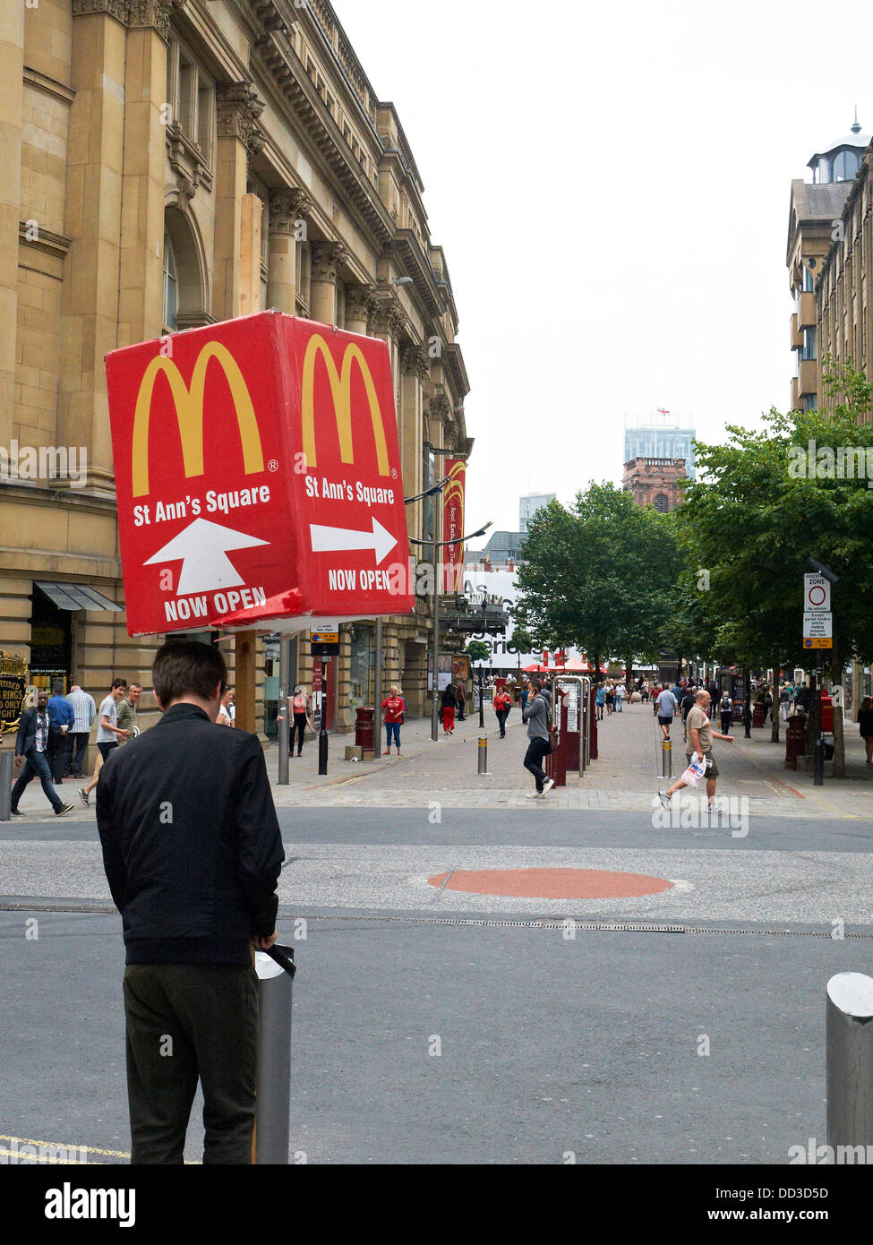 Walking MacDonald advertising sign in Manchester UK Stock Photo - Alamy