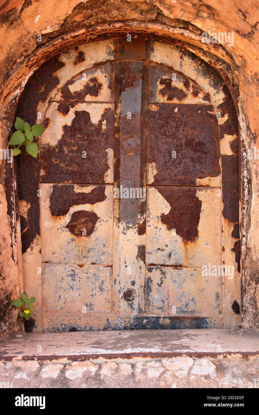 Small corroded, closed window made of iron Stock Photo - Alamy