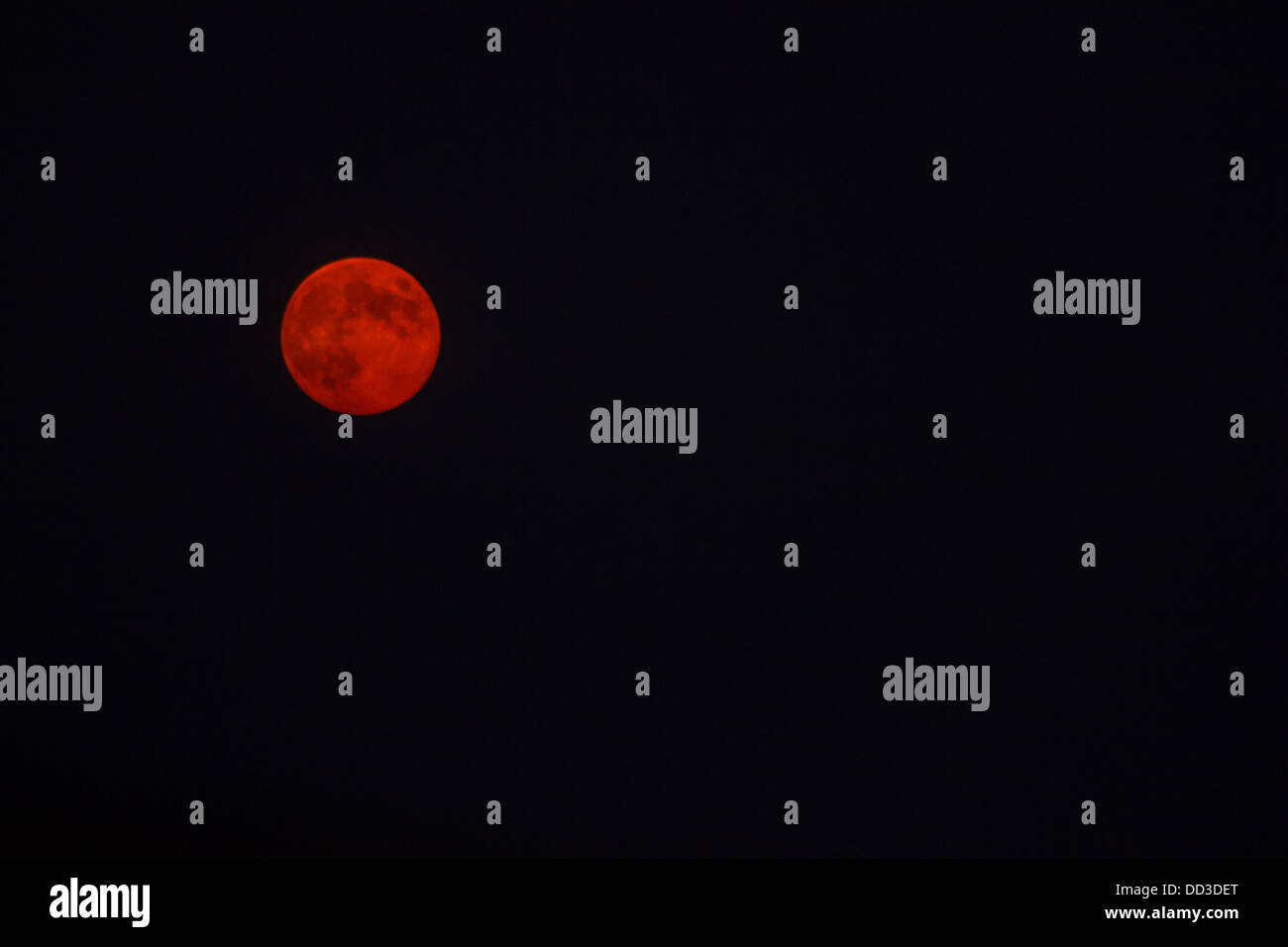 Full moon in the night with red light reflection due to a fire Stock ...