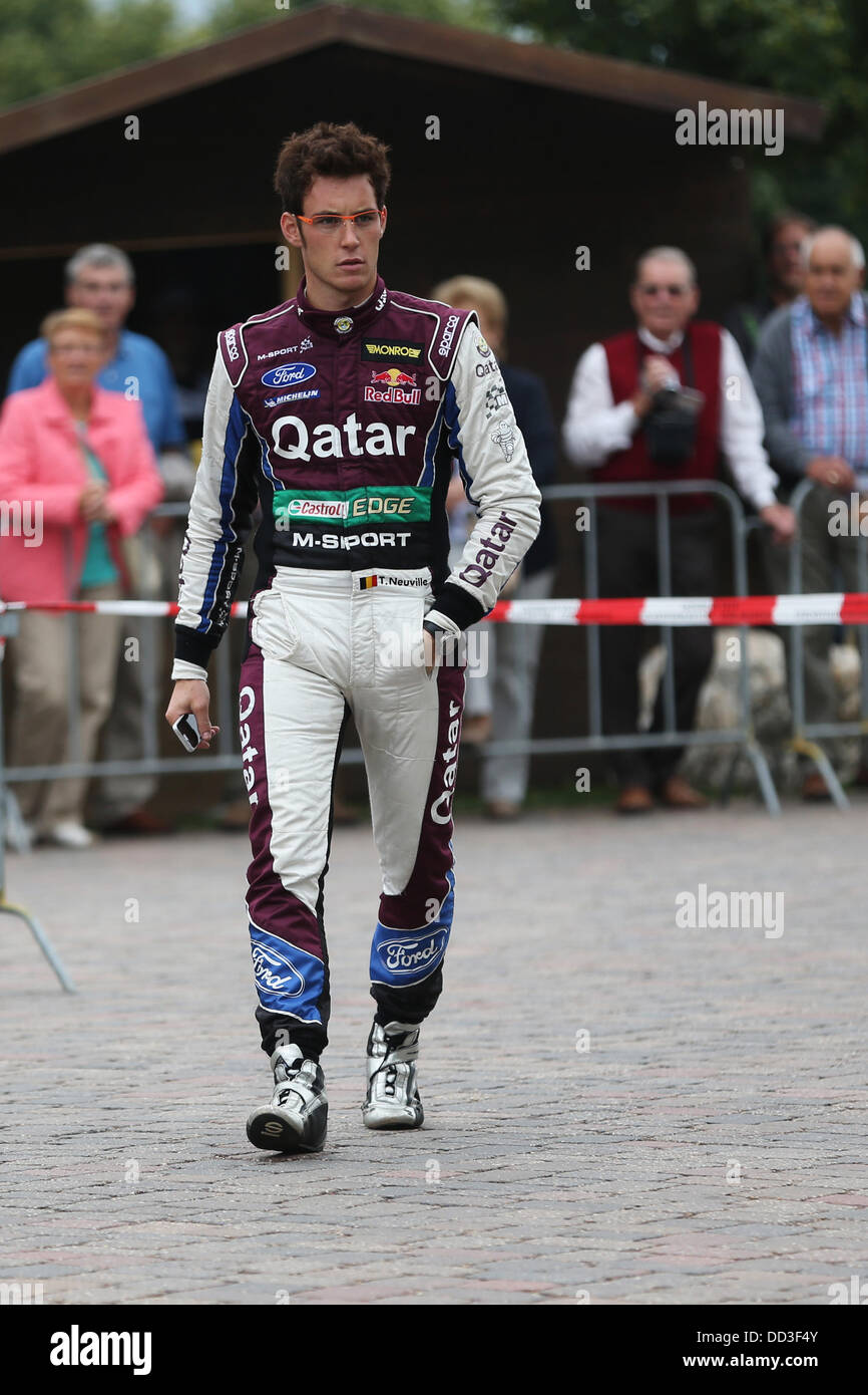Belgian rally driver Thierry Neuville walks past an audience after the ...