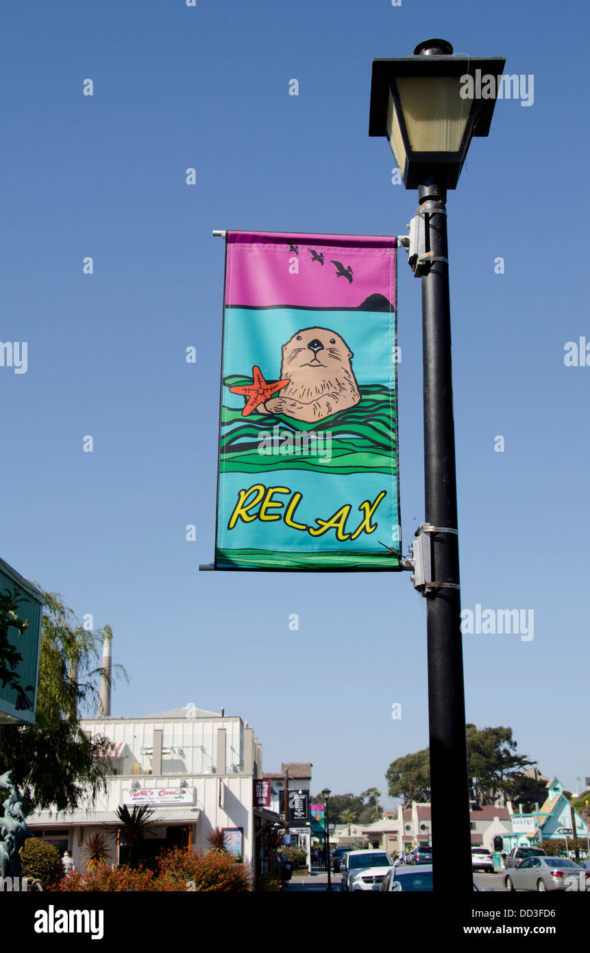 California, Pacific Coast, Morro Bay. Moro Bay street sign with otter ...
