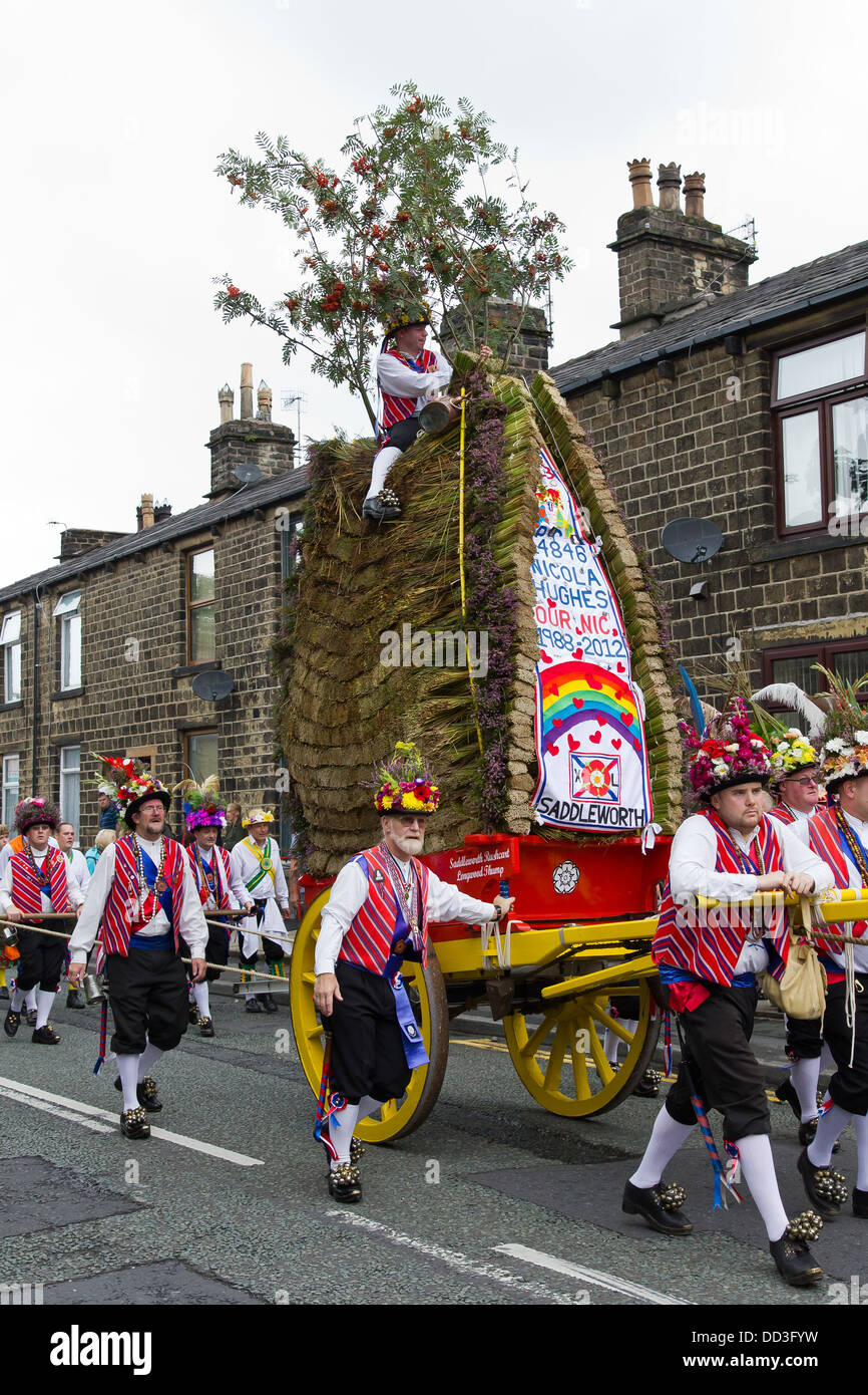 Morris dancers pulling the cart at Saddleworth Rushcart 2013 Stock ...