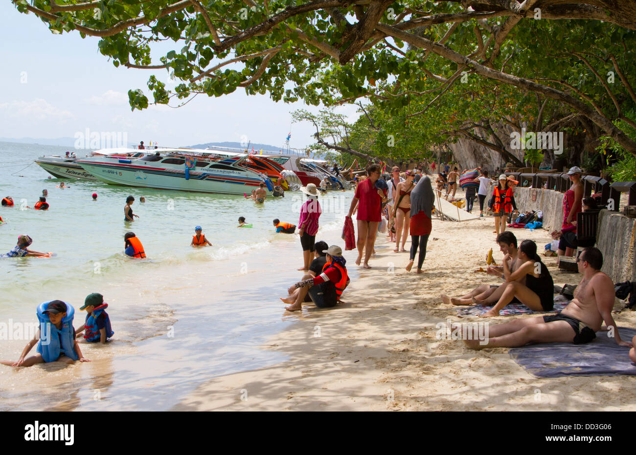 People sunbath on beach in hi-res stock photography and images - Alamy