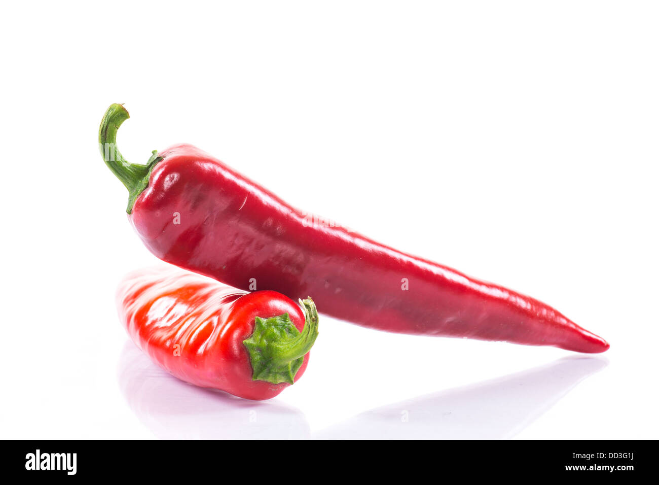 Two red chili peppers isolated on the white Stock Photo - Alamy