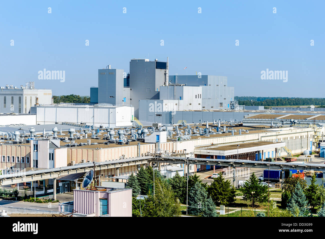 The factory is photographed against the blue sky Stock Photo - Alamy