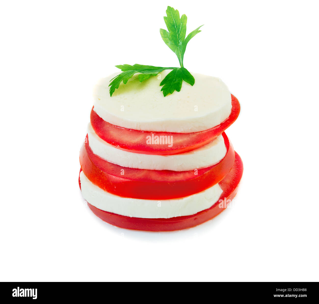 Mozzarella and tomato slices arranged in stack isolated over white ...