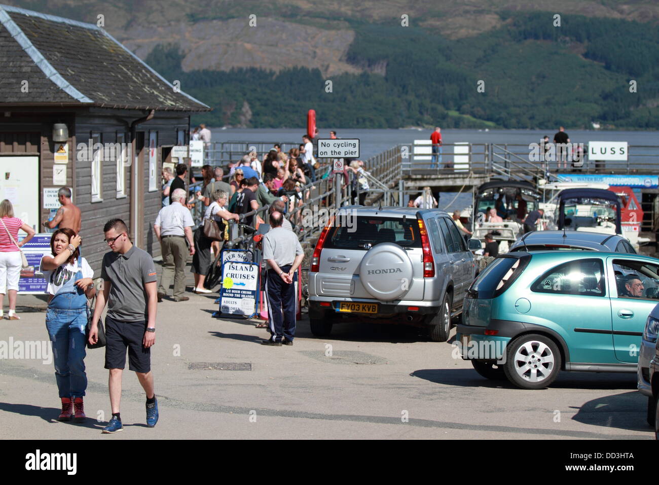 A crowd of people at the pier in Luss, Loch Lomond, Alexandria ...