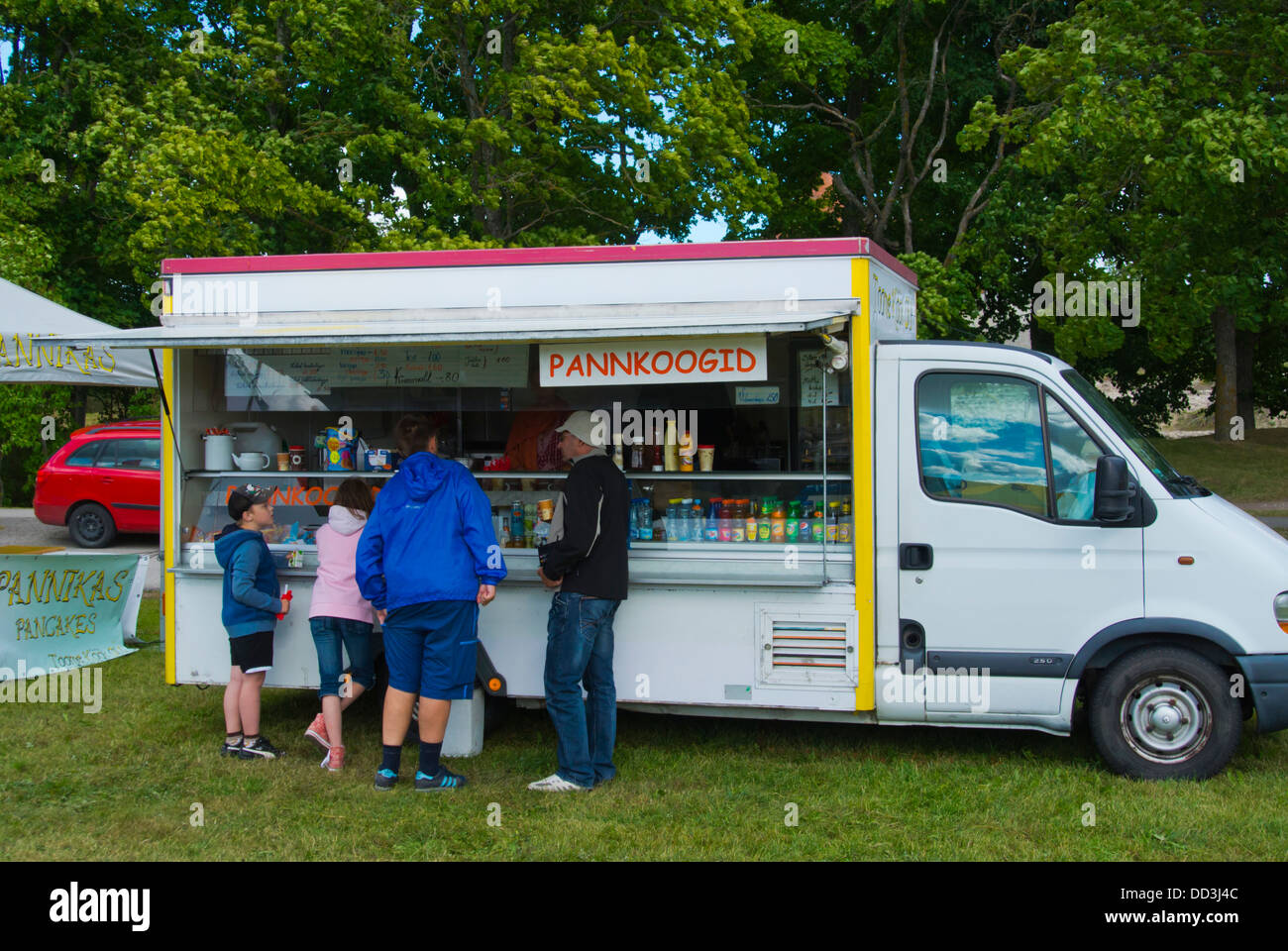 Drinks and snacks stall selling pancakes in summer weekend market near ...