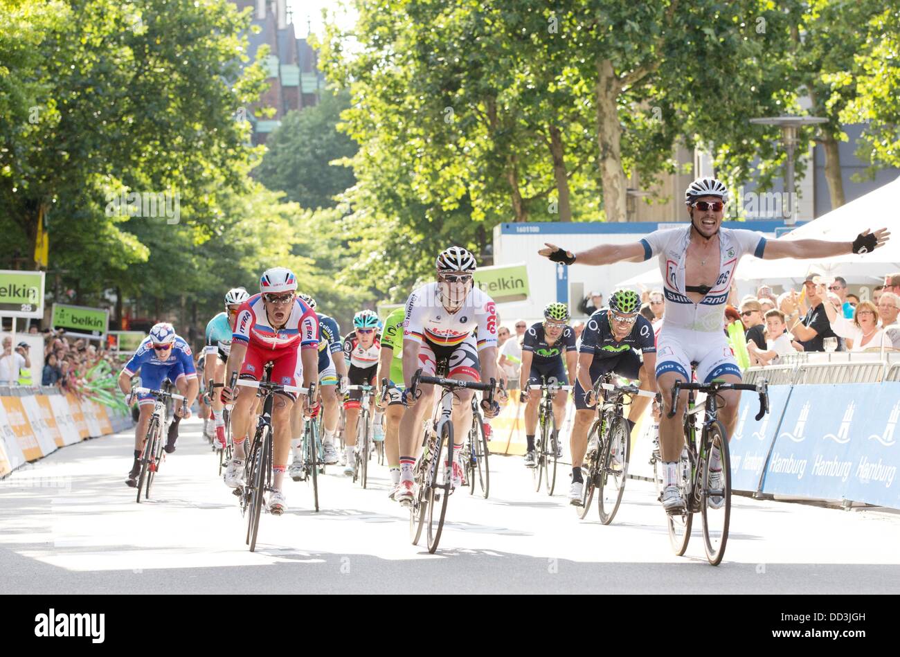German cyclist John Degenkolb (R) of Team Argos-Shimano cheers at the ...