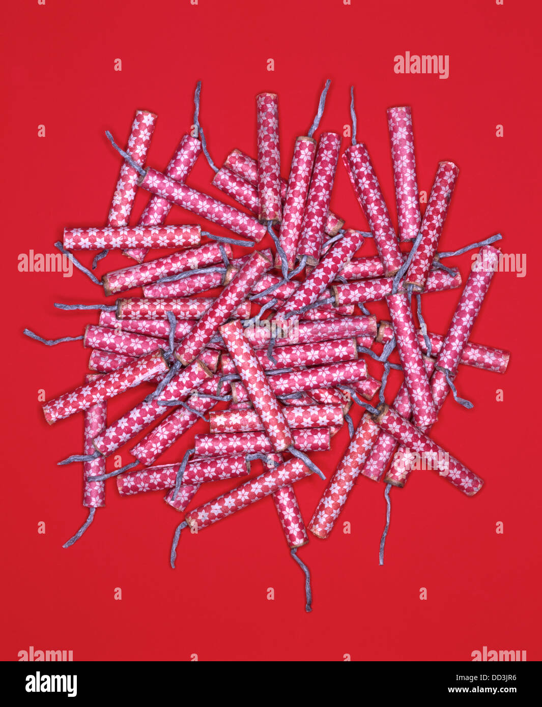 A group of loose red firecrackers on a bright red background Stock ...