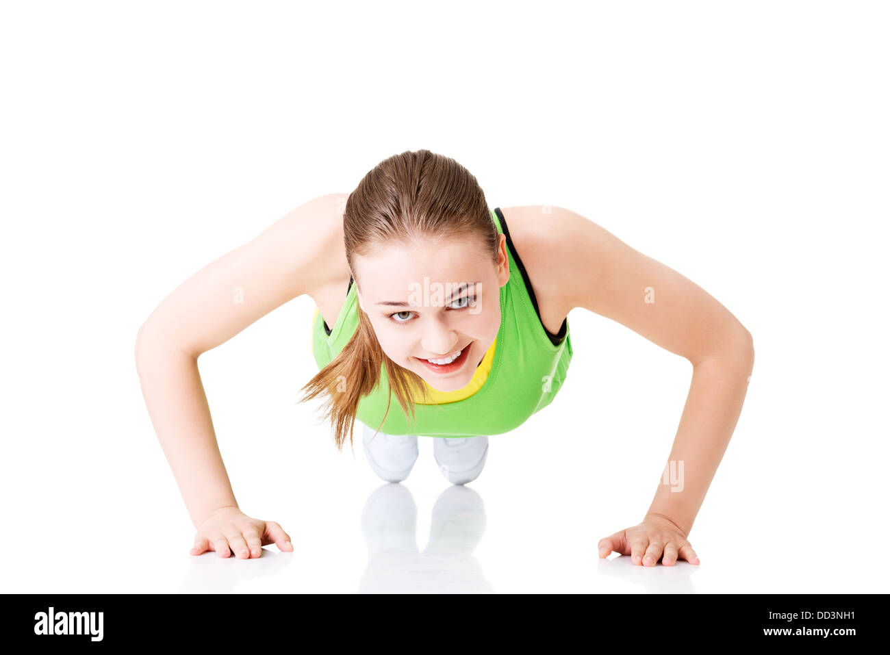 Fitness woman doing push ups , isolated on white background Stock Photo ...