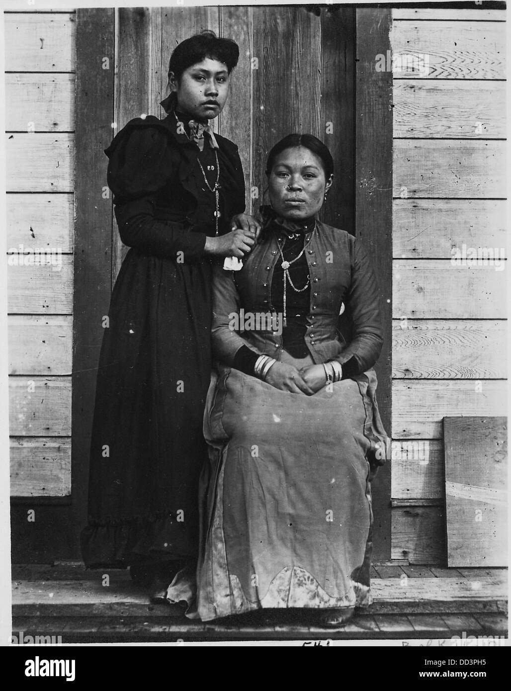 A photograph of two young Native American women, capturing a moment ...