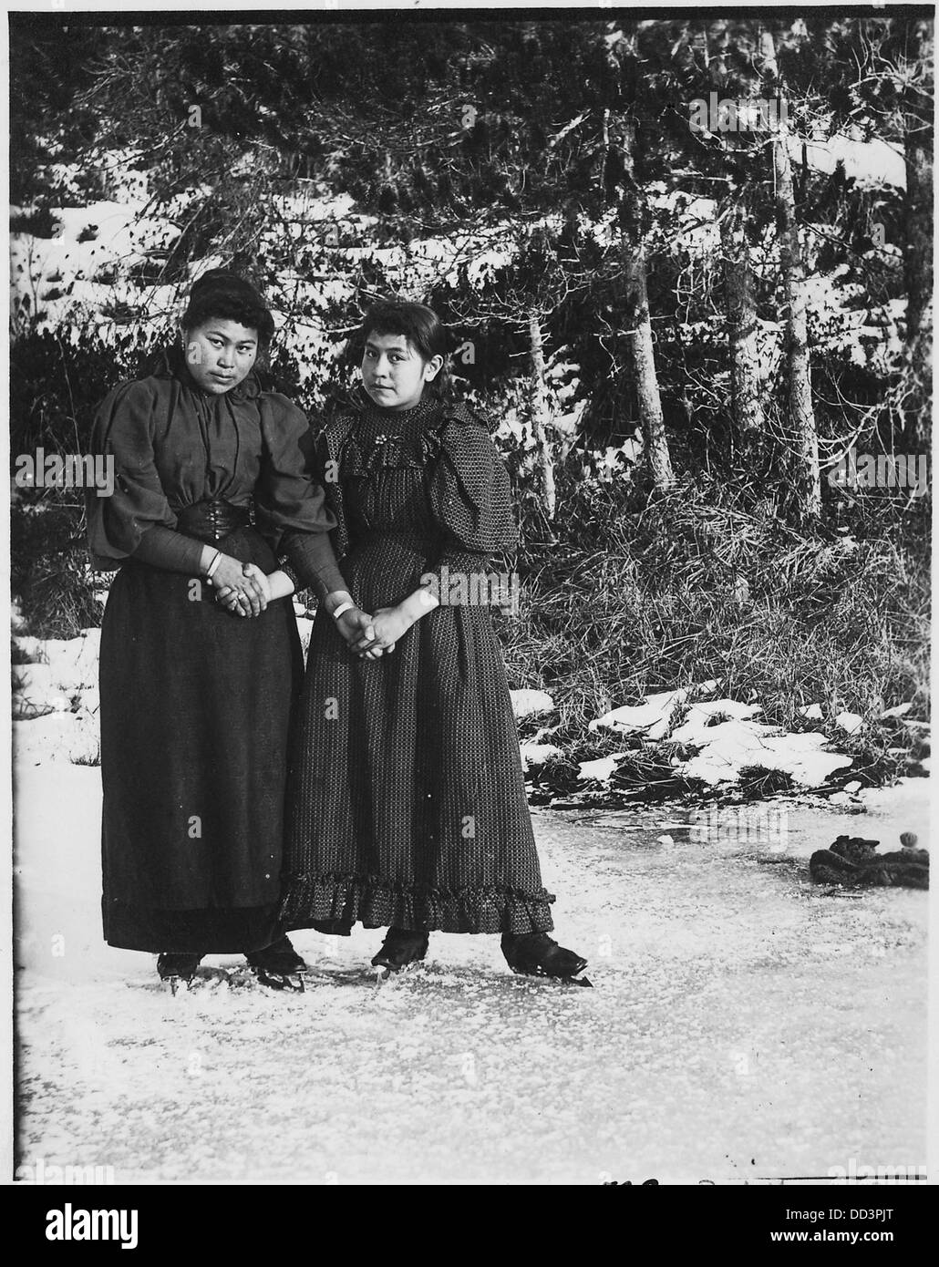 Two young Native American women are pictured, capturing a moment of ...