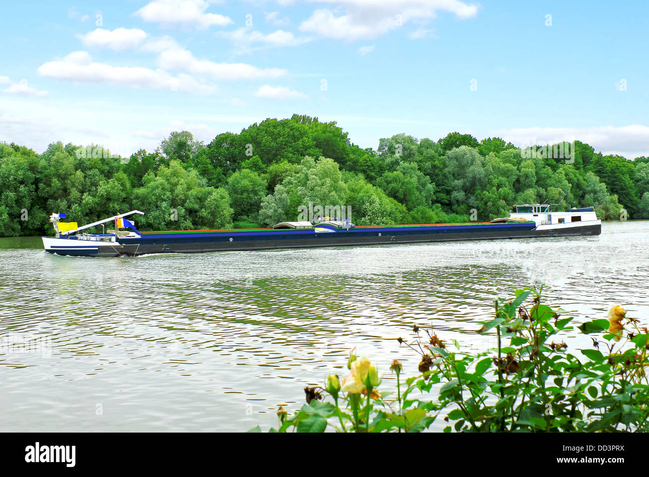 Loaded barge floating in the canal. The Netherlands Stock Photo - Alamy