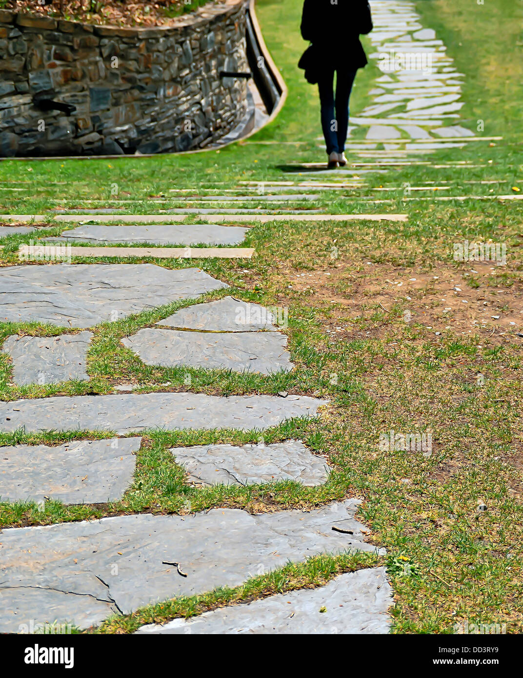 Woman walking across stone hi-res stock photography and images - Alamy
