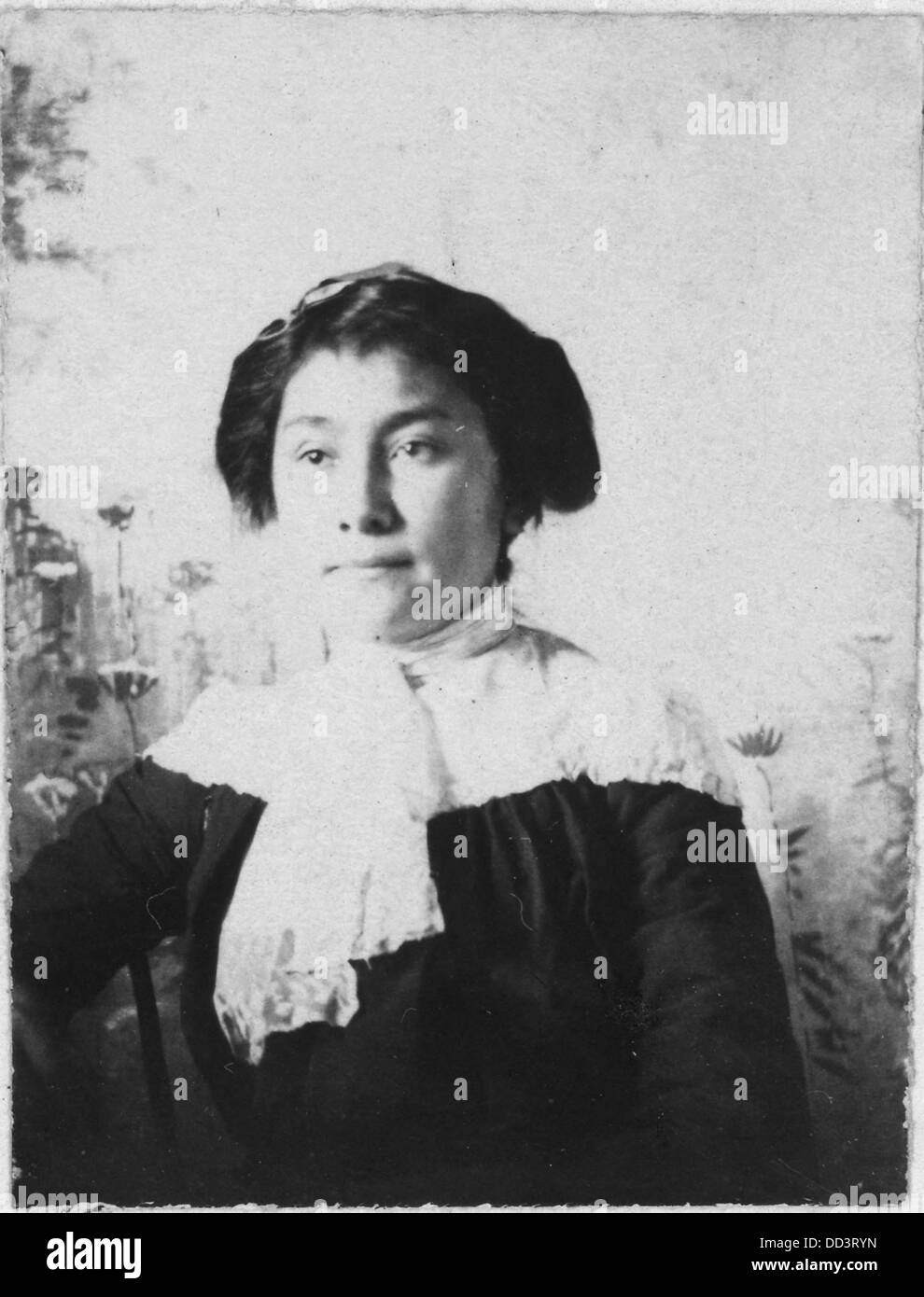 A photograph featuring a young Native American woman, capturing the ... A photograph featuring a young Native American woman, capturing the ...