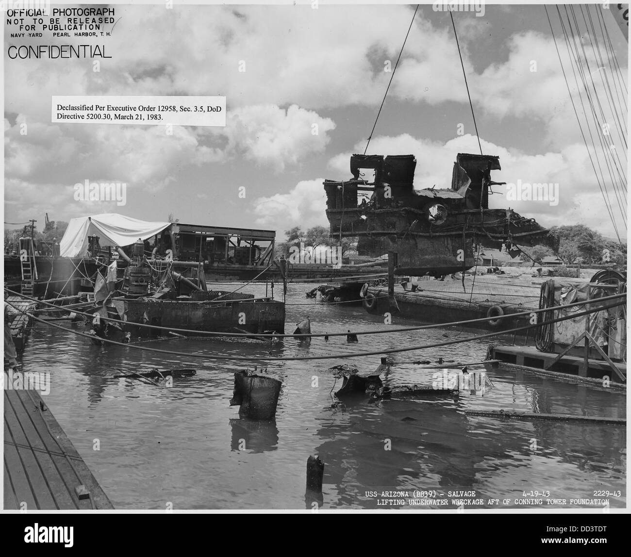 The image shows the salvage operation of the USS Arizona (BB39 ...