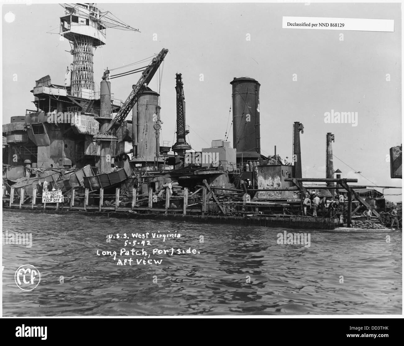 This photograph shows the USS West Virginia on May 5, 1942, with a long ...