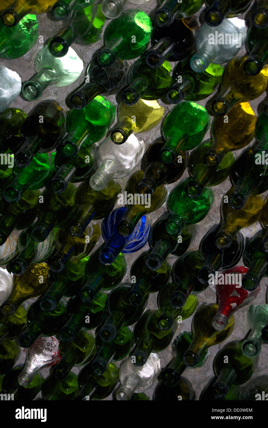 Multi-coloured recycled glass bottles built into unusual building at ...