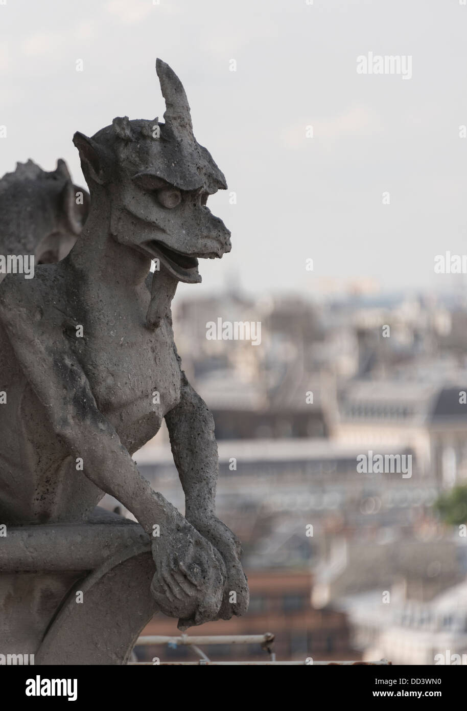 Gothic chimera on Paris' Notre Dame cathedral looks over the city Stock ...