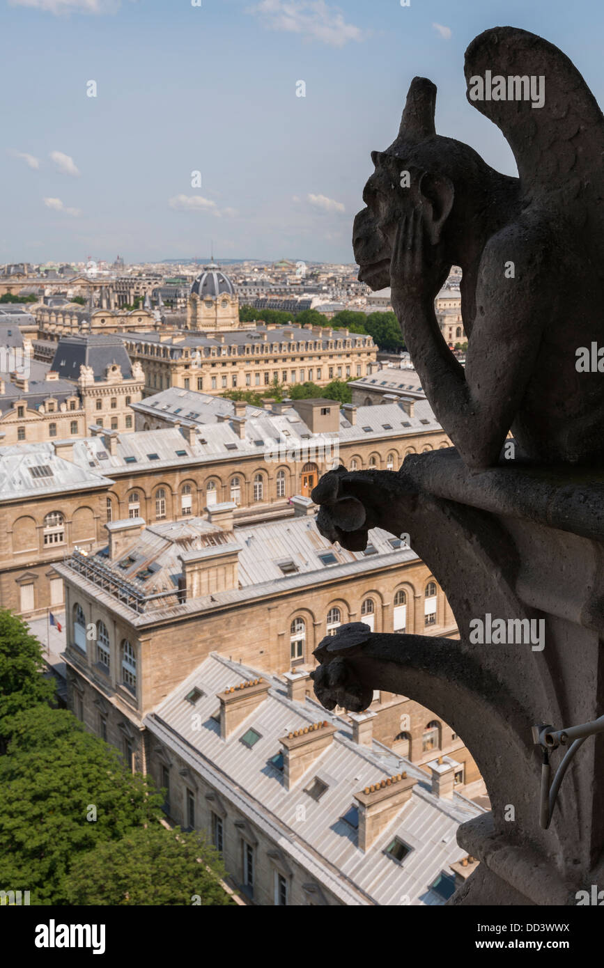 Gothic chimera on Paris' Notre Dame cathedral looks over the city Stock ...