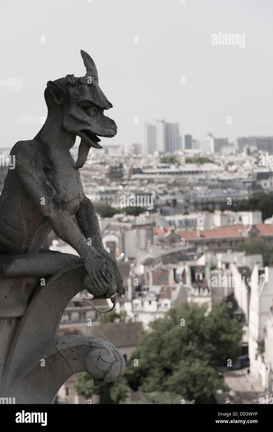 Gothic chimera on Paris' Notre Dame cathedral looks over the city Stock ...
