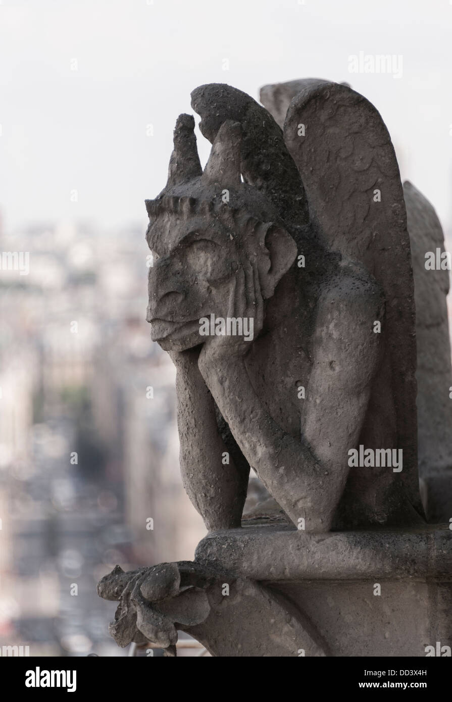 Gothic chimera on Paris' Notre Dame cathedral looks over the city Stock ...