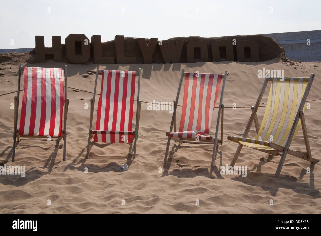 Deck chairs and the Hollywood sign in sand sand at the Weston Sand ...