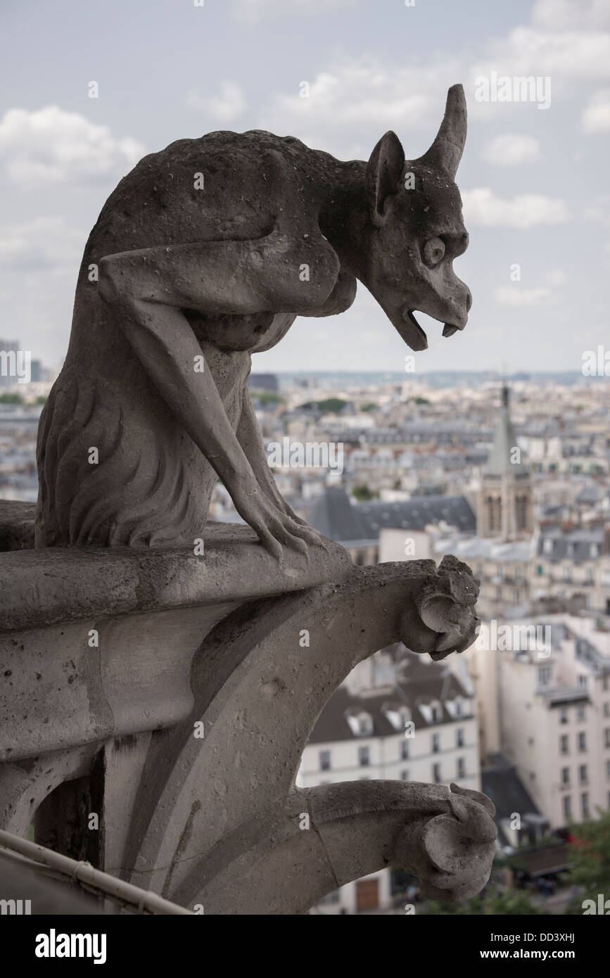 Gothic chimera on Paris' Notre Dame cathedral looks over the city Stock ...