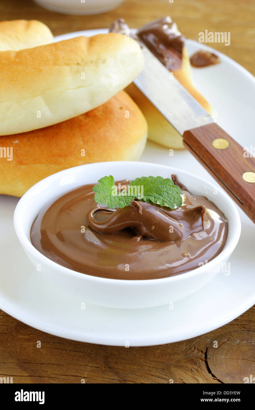 Chocolate nut paste (nutella) for breakfast with bread rolls Stock ...