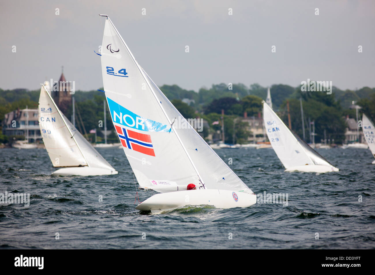 Two 2.4 meter racing sailboat competing at a sailing championships in ...