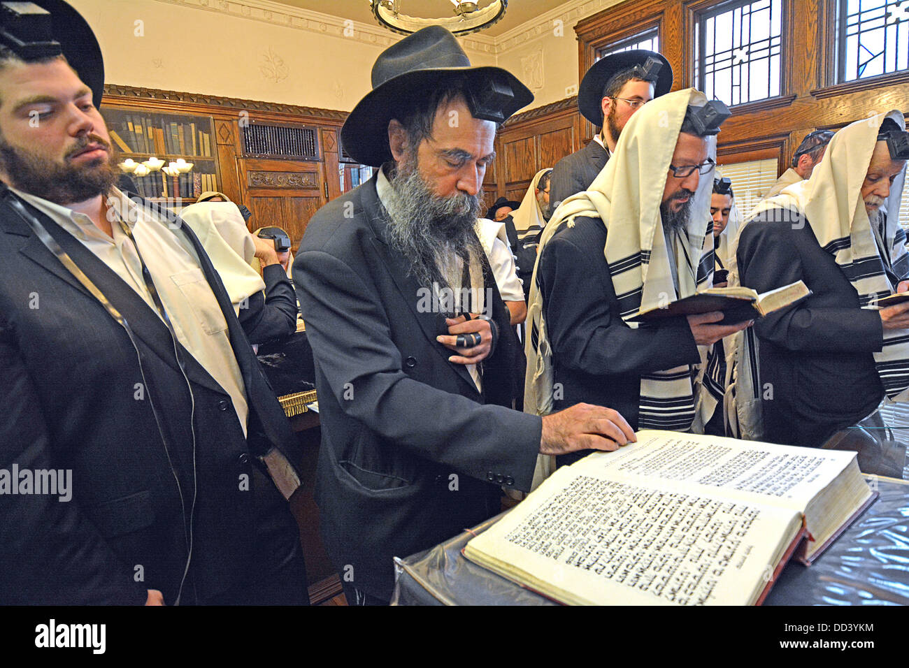 Religious Jewish men pray in the Rebbe's office at Lubavitch ...