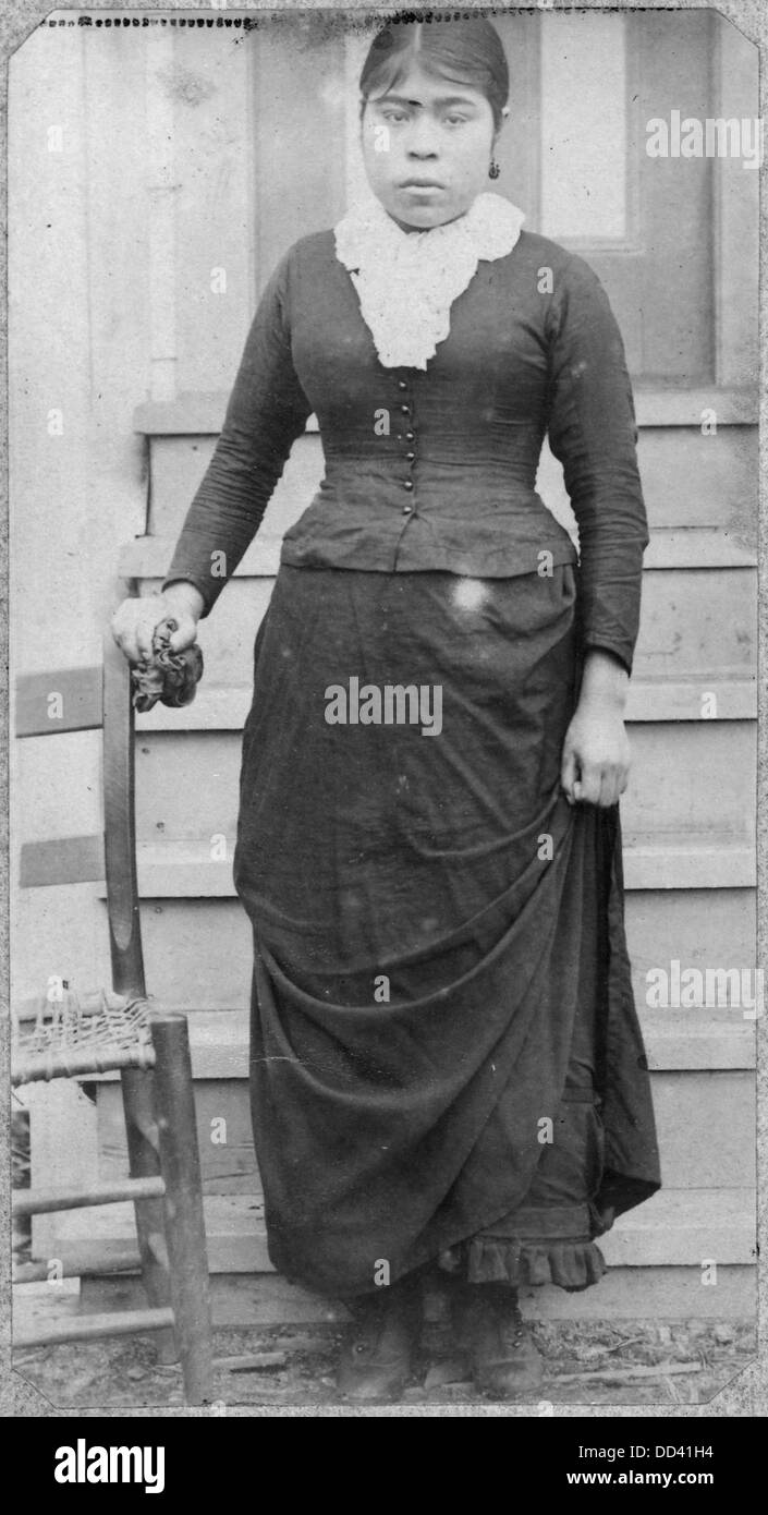 A portrait of a young Native American woman, capturing her traditional ...