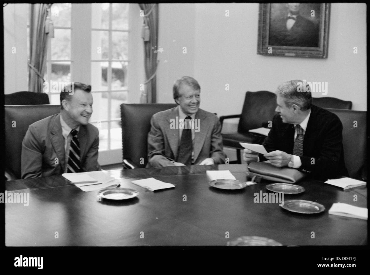 This image features Zbigniew Brzezinski, Jimmy Carter, and Cyrus Vance ...