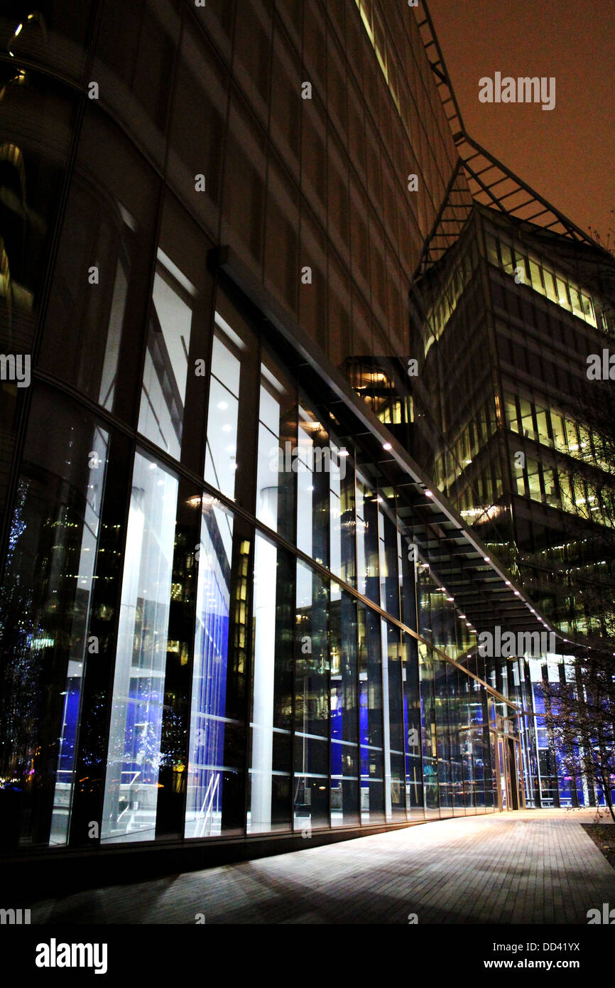 More London Riverside development near Tower Bridge floodlit at night ...