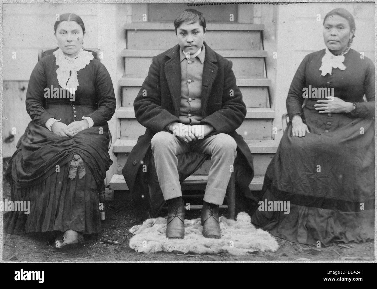 A photograph featuring two Indian women and one Indian man, likely ...