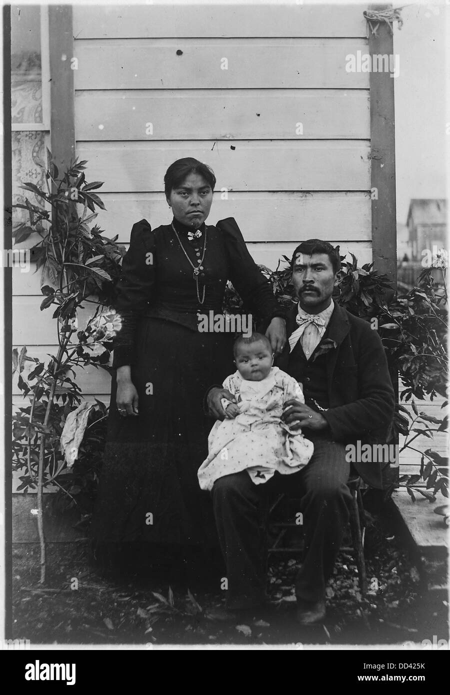 A portrait of Robert Ridley and his family, including his wife and baby ...
