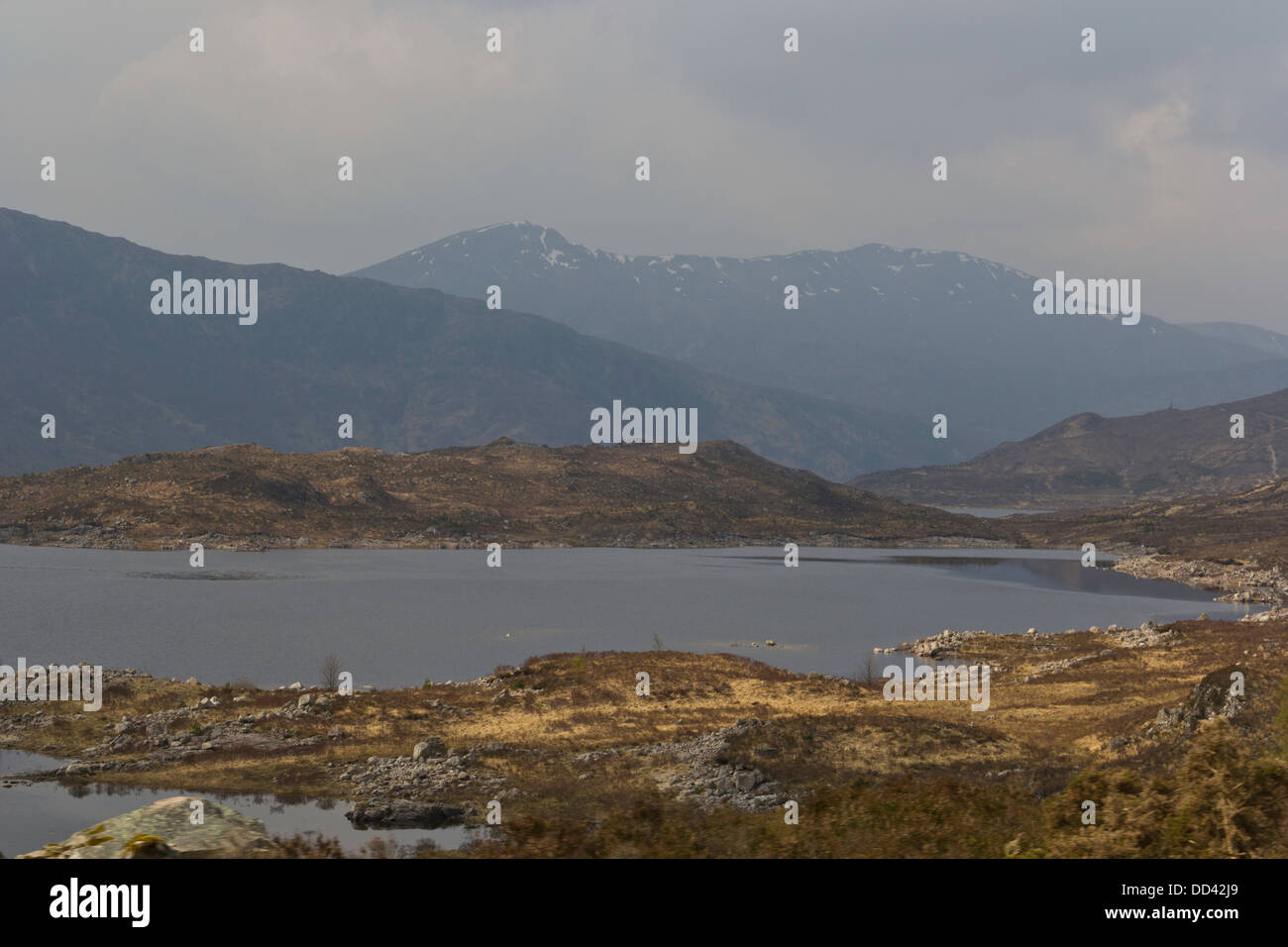 Rugged shoreline and waters of a Loch in the Scottish Highlands. Looks ...