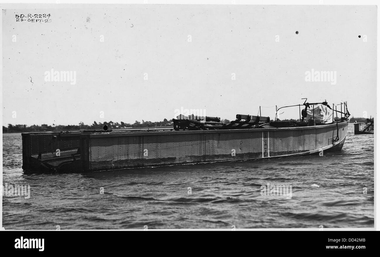 A seaplane barge is photographed from a 3-4 rear view in San Diego ...