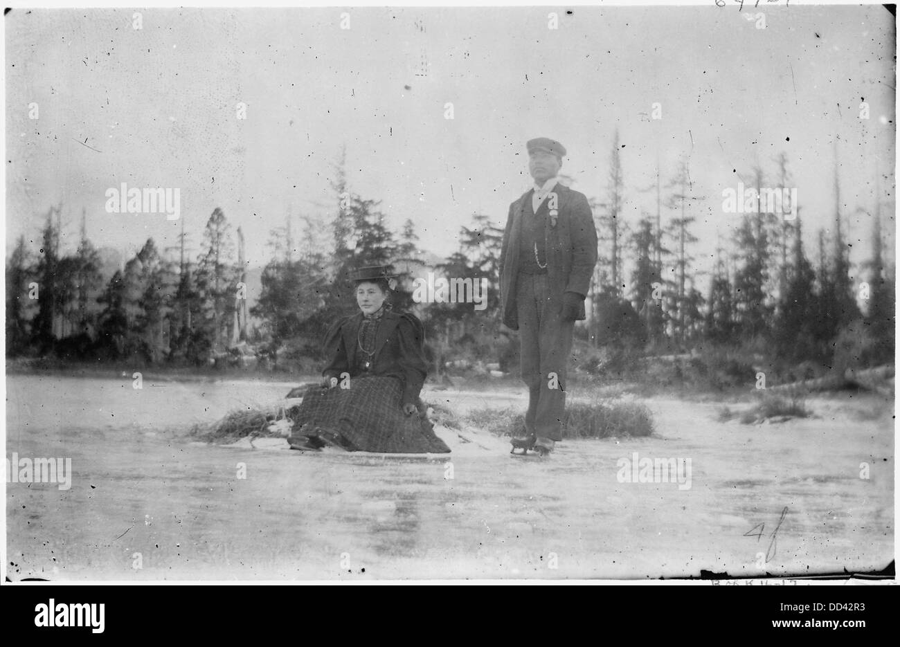 A young Native American couple is seen ice-skating, showcasing a moment ...