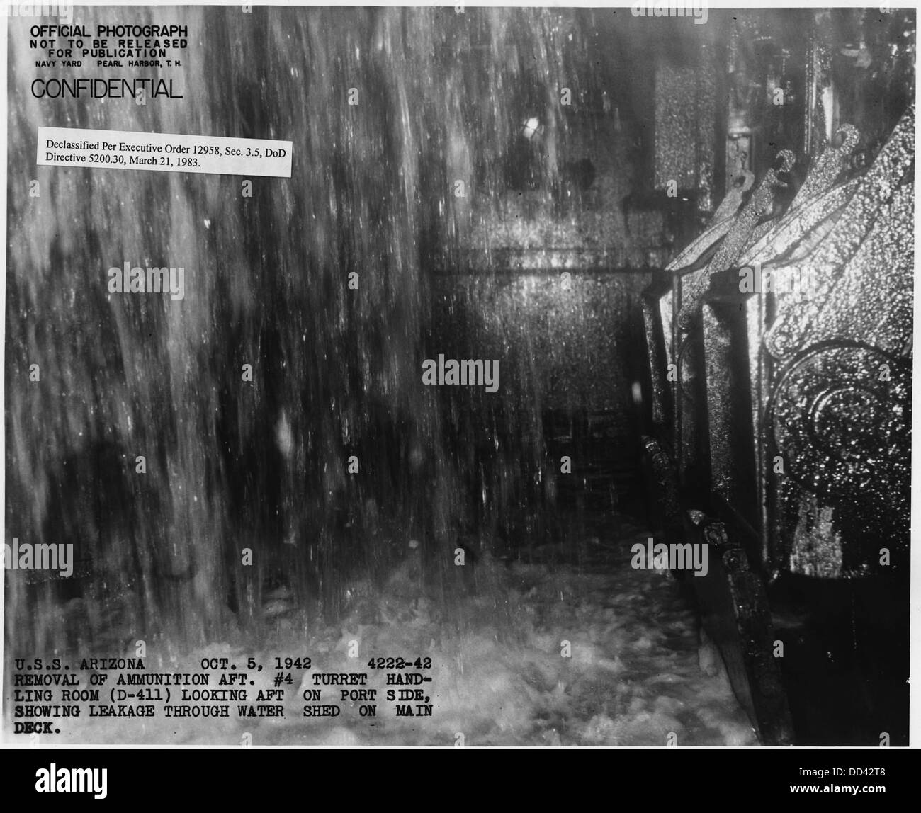 The image shows the removal of ammunition from the aft turret of the ...