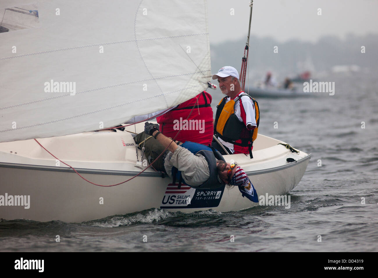 Sailors with disabilities competing at a sailing race in a Sonar Dinghy ...