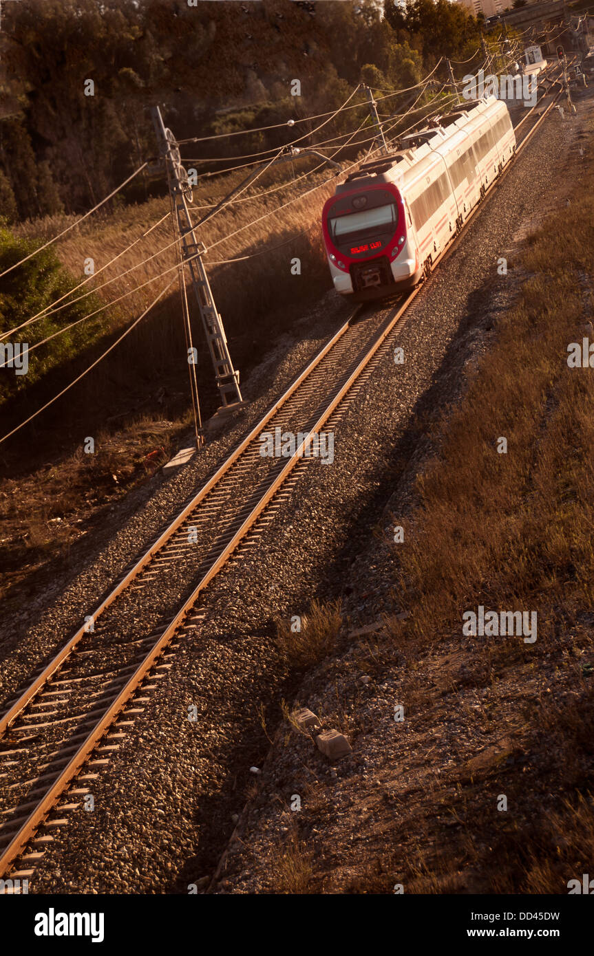 Passenger train leaving junction Stock Photo - Alamy