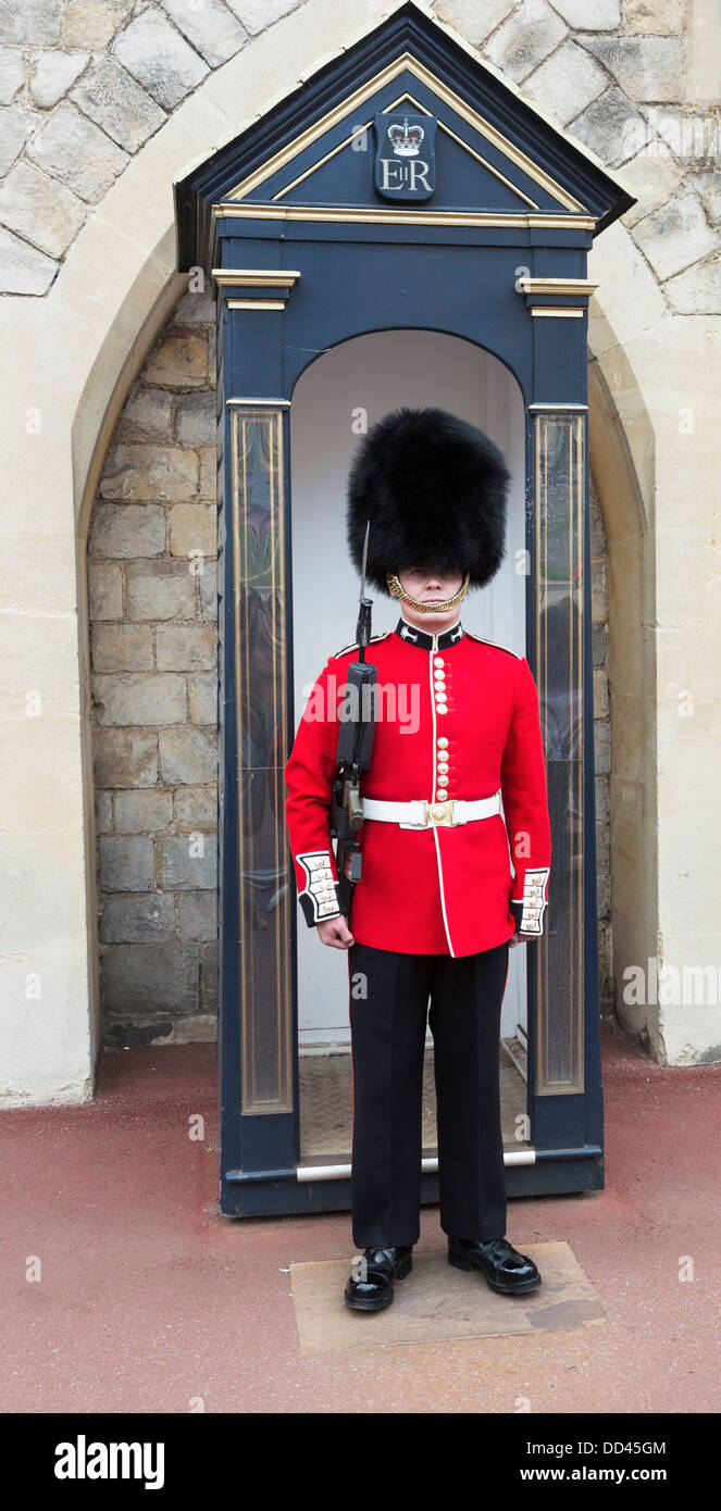 Soldier in Queen's Guard at Windsor Castle, England, with red uniform ...