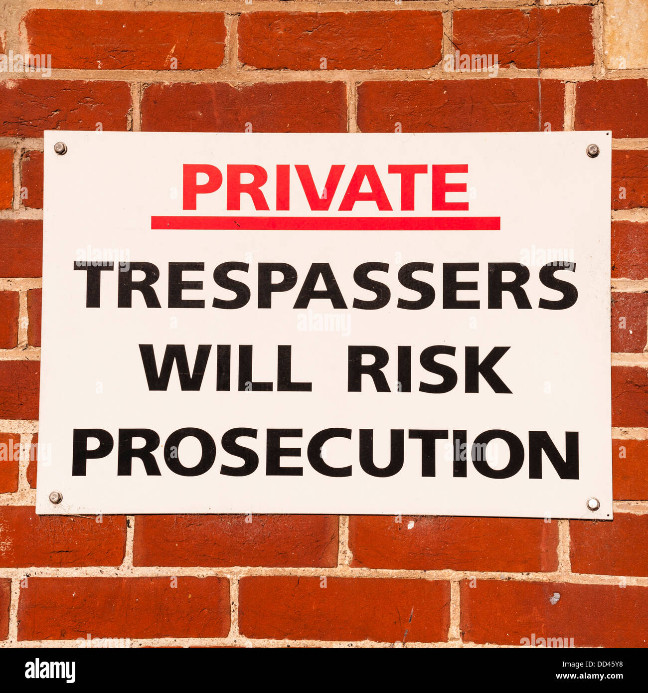A Trespassers will risk prosecution sign Stock Photo - Alamy