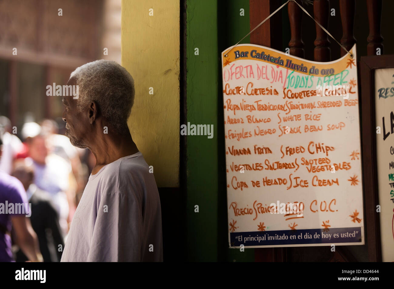 A man looking hungry stands by the menu to a tourist restaurant in ...